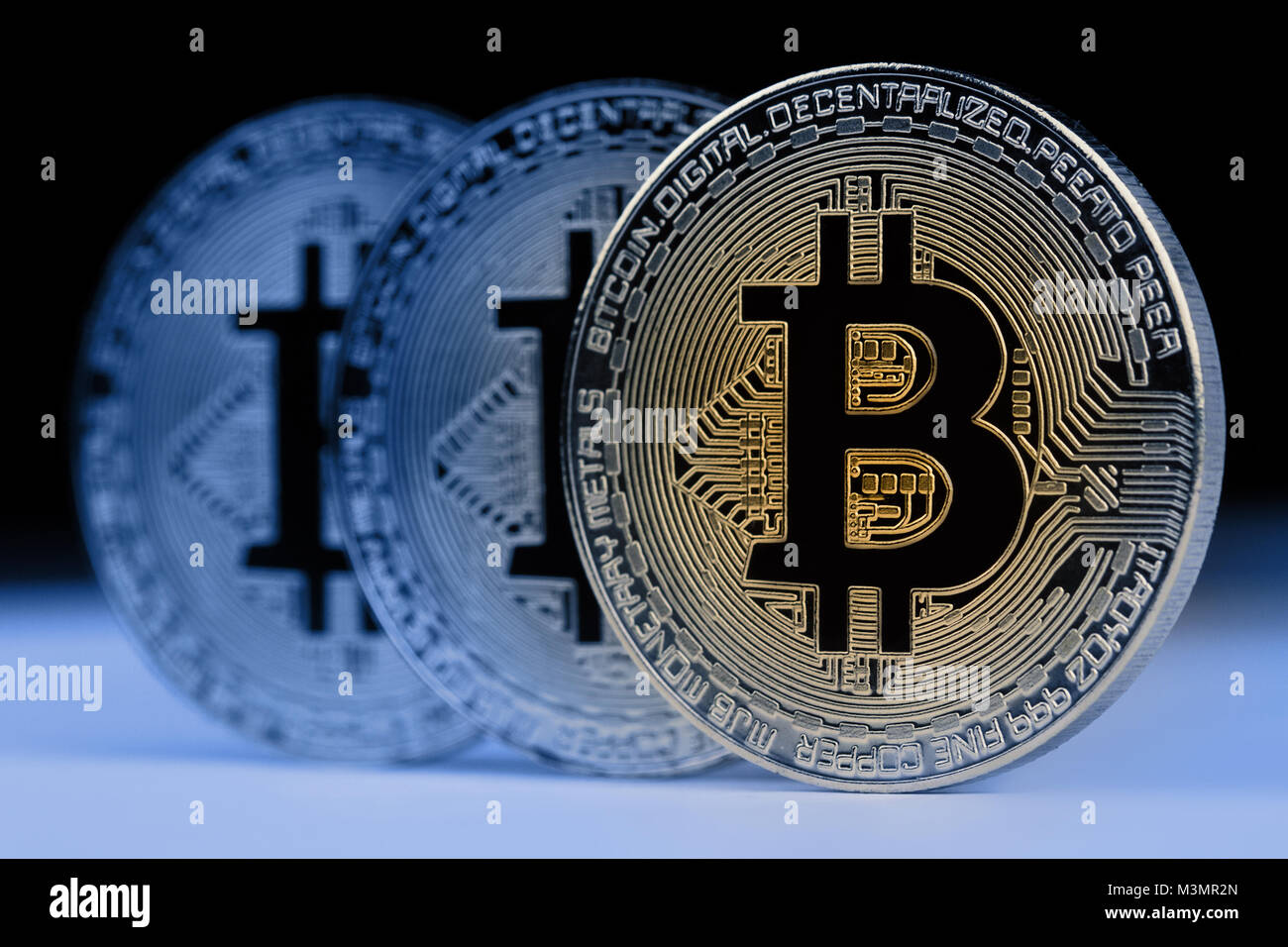 horizontal front view closeup of bitcoin golden metallic coins on dark ...