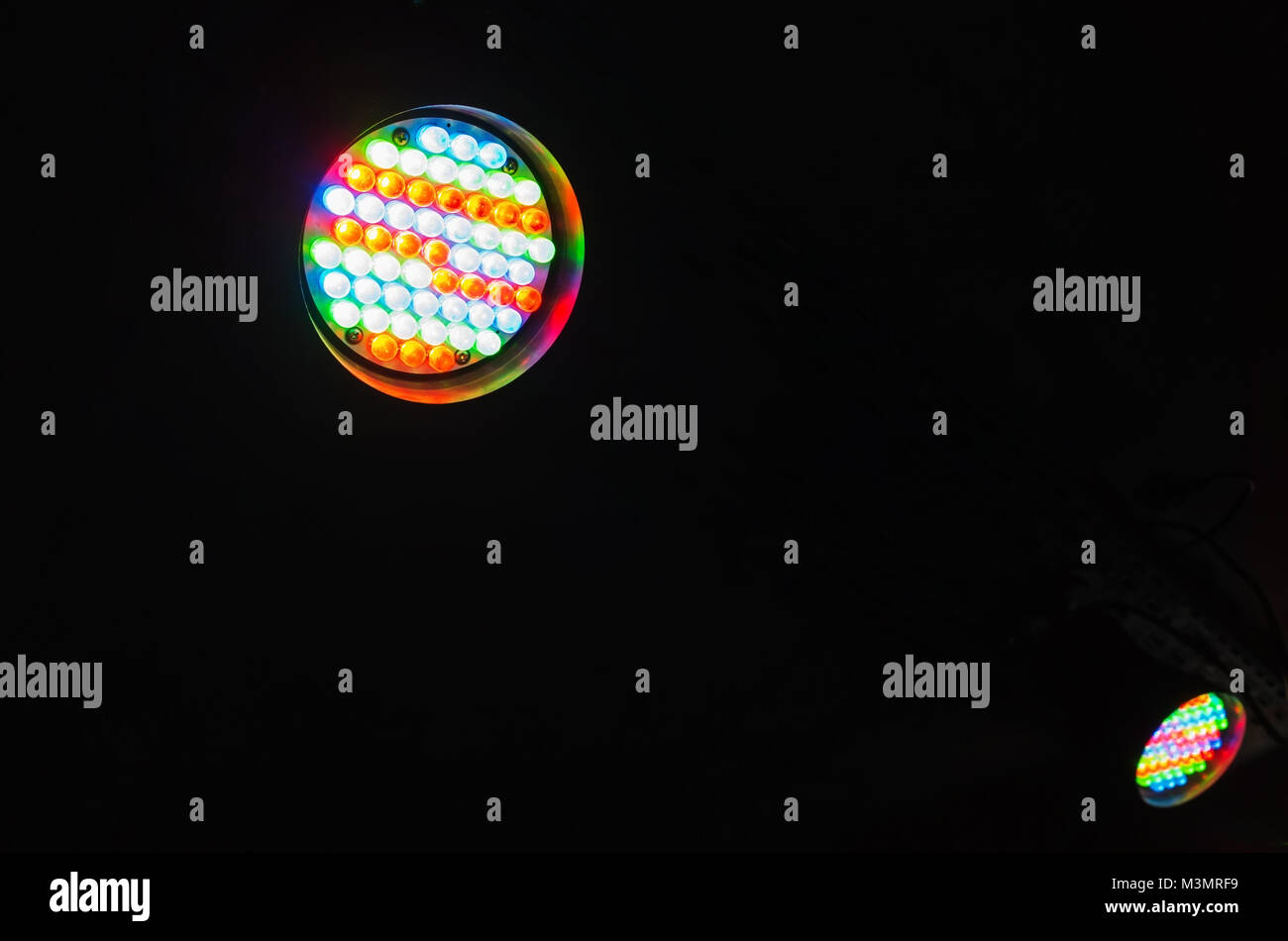 Round colorful LED spot light. Modern stage illumination equipment ...