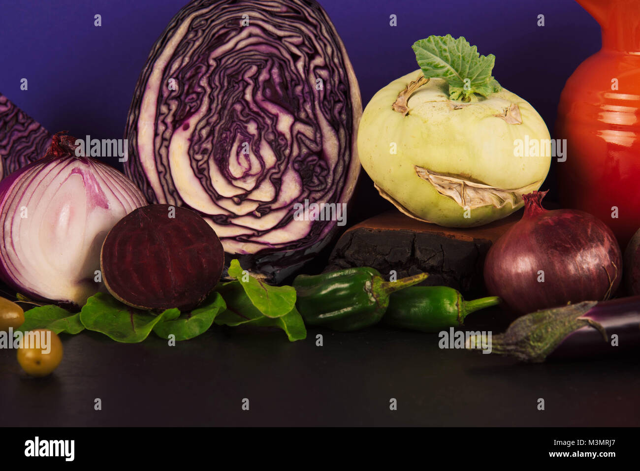 Assortment of raw organic purple and green vegetables Stock Photo - Alamy