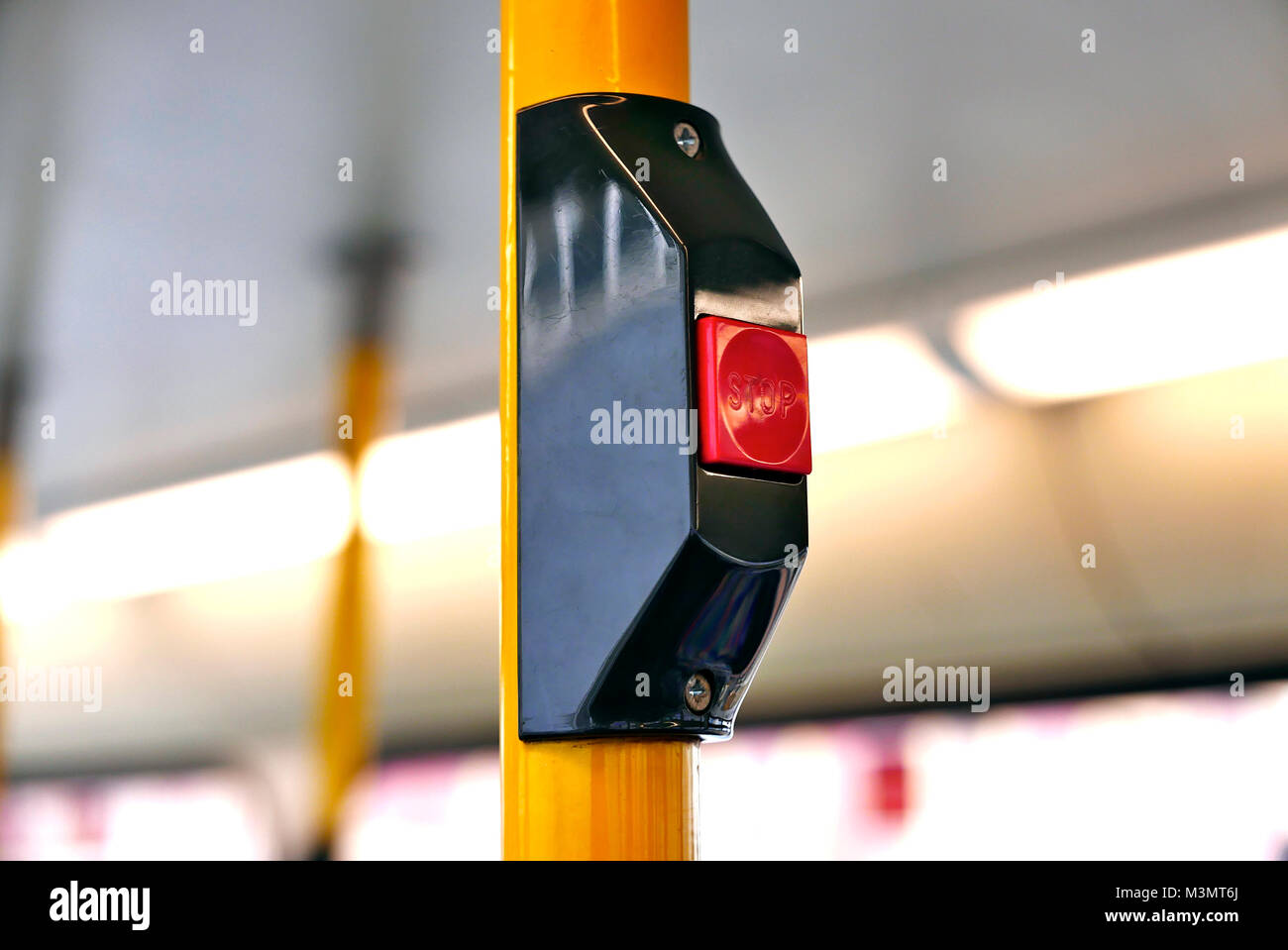 Bell stop button on public transport bus Stock Photo - Alamy