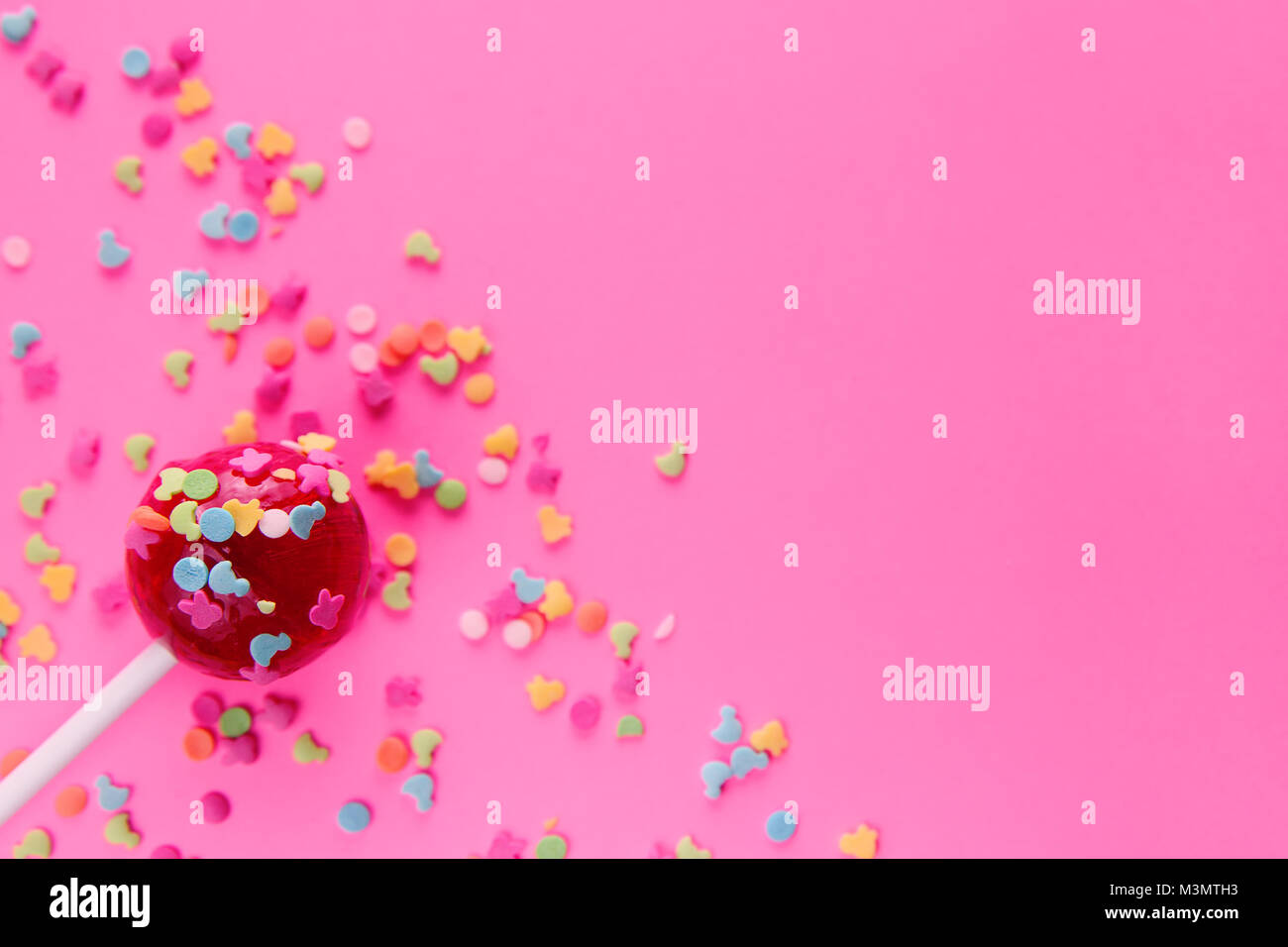 pink round lollipop close-up on pink background Stock Photo - Alamy