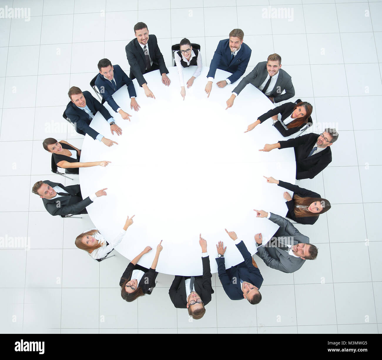 group of business people sitting at the round table. the business ...