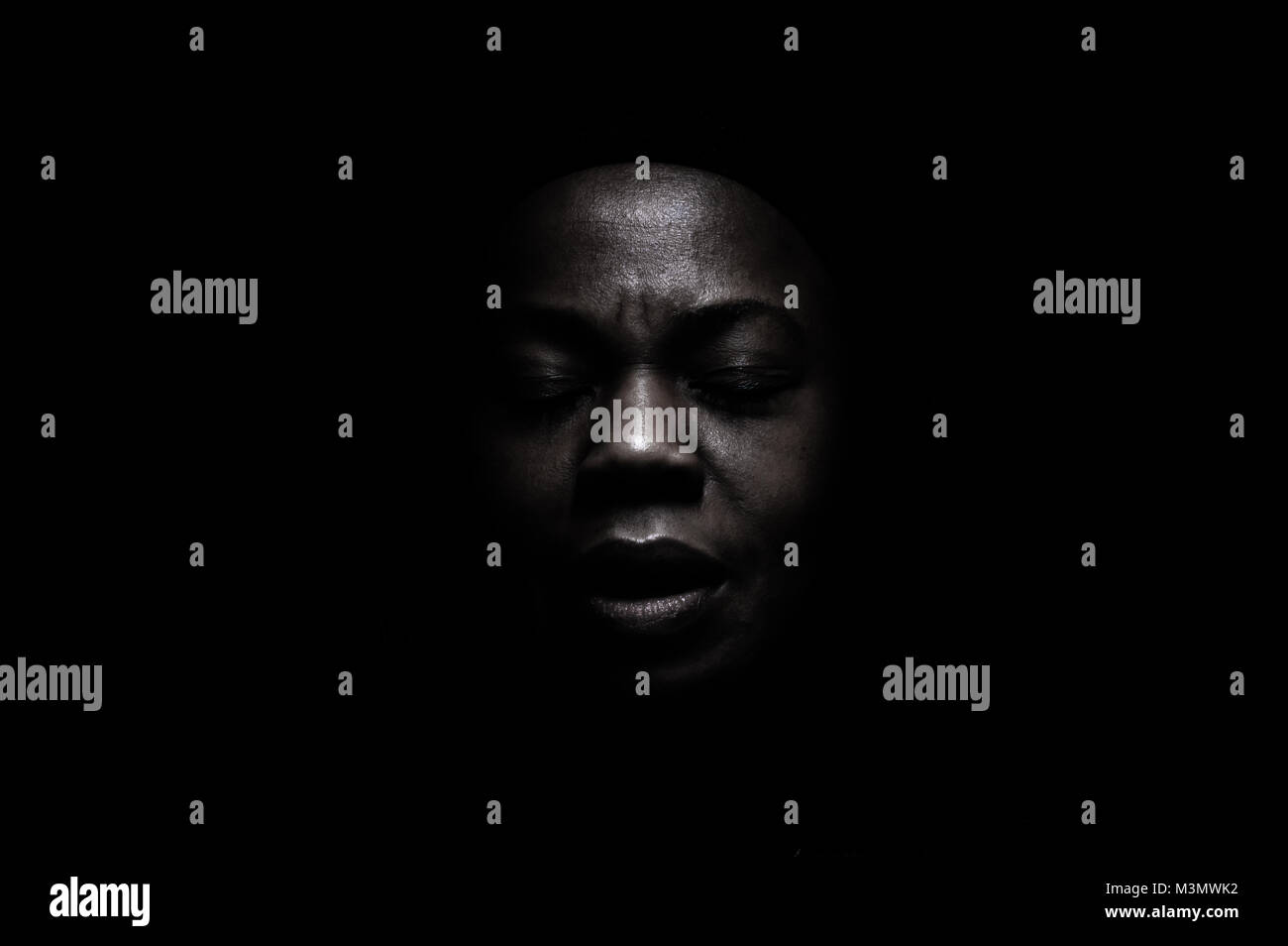 Black face in the dark face shot Stock Photo - Alamy