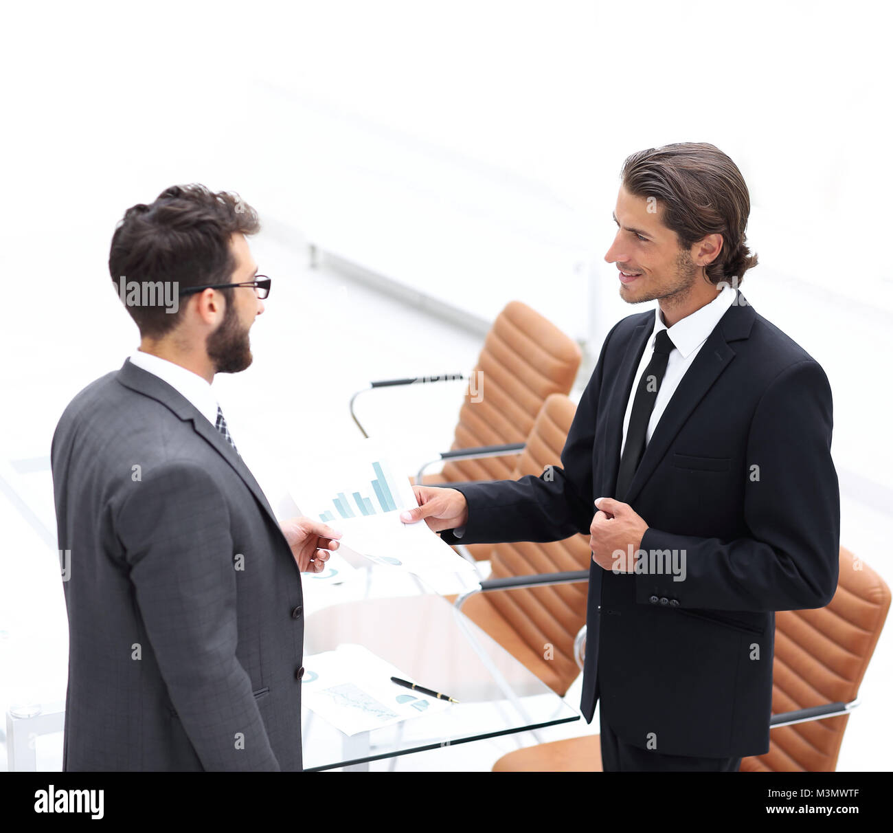 two businessmen talking in the office Stock Photo - Alamy