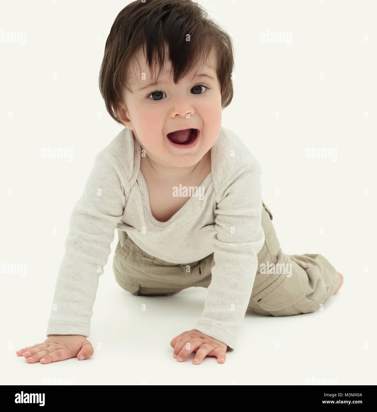 the baby learns to crawl isolated on white background Stock Photo - Alamy
