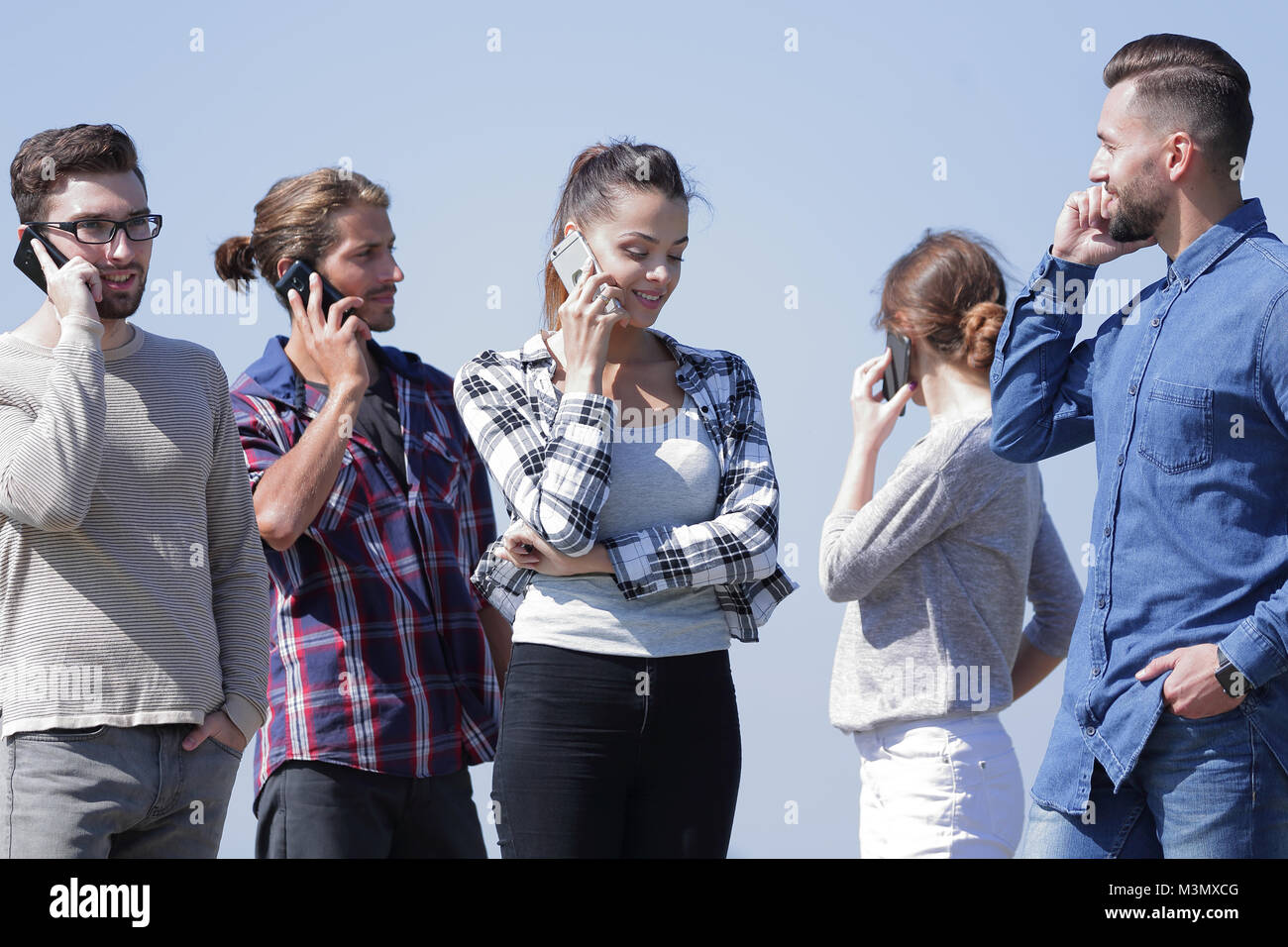 young people talking on their smartphones Stock Photo - Alamy
