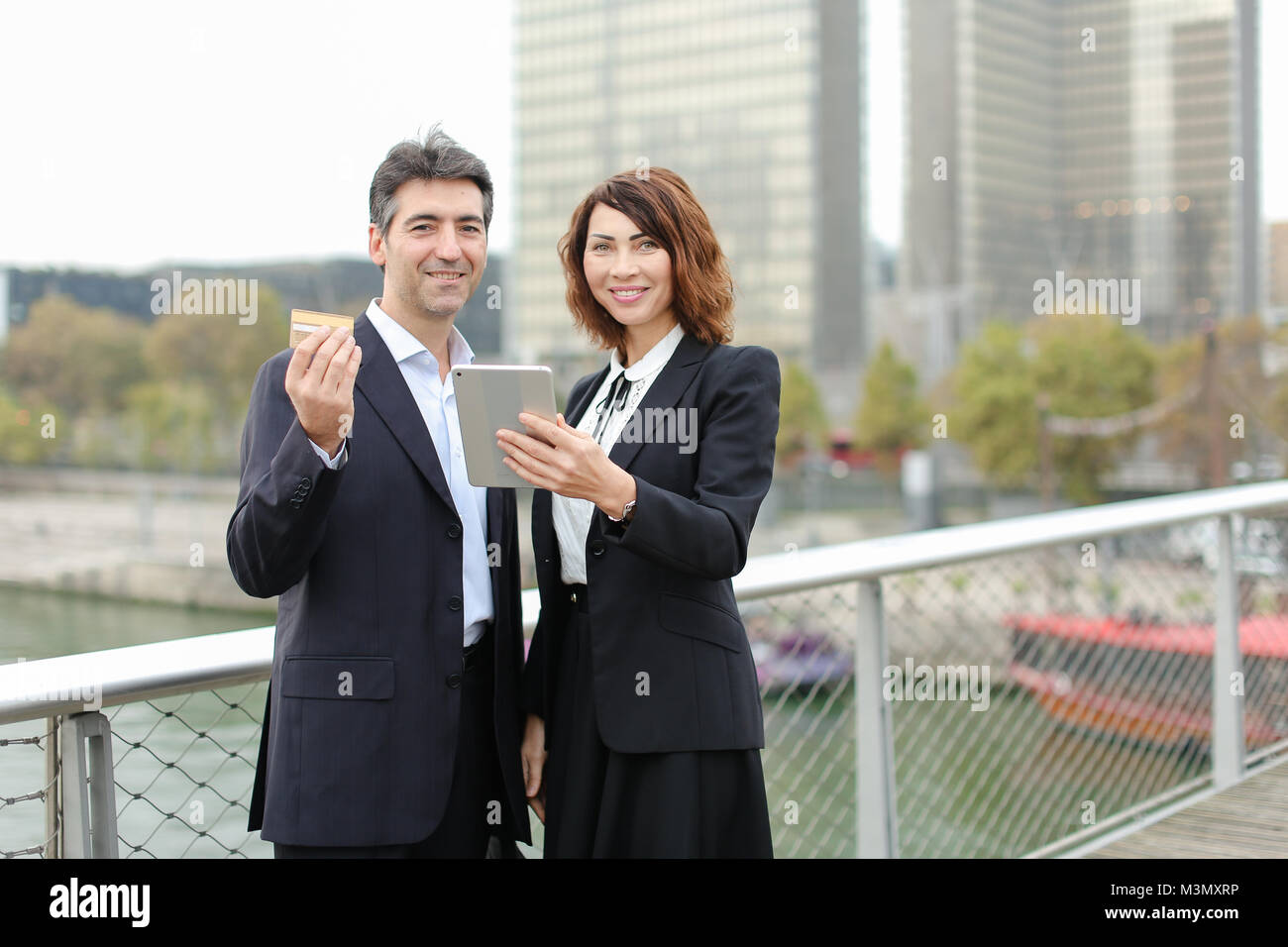Married business couple make purchases by credit card Stock Photo - Alamy
