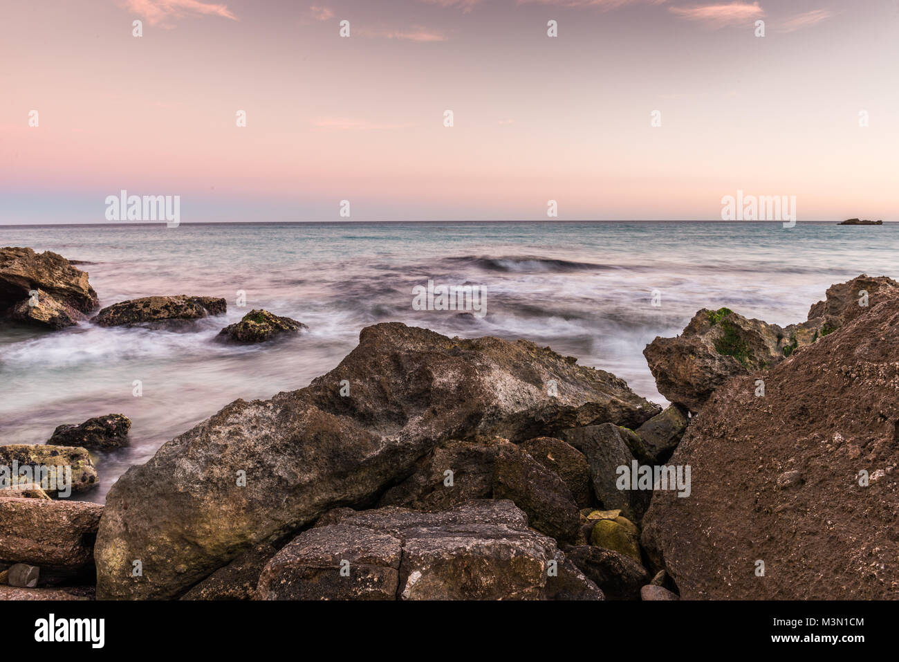 Long exposure photograph of the shore of the coast of Cala Moll in the ...