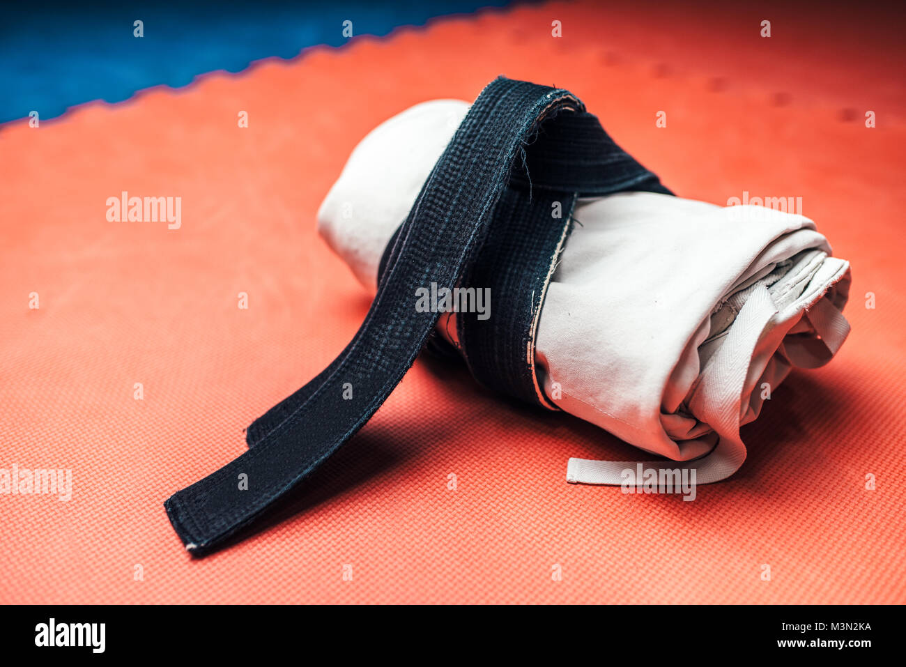 Martial arts, white kimono and black belt closeup, nobody. Fighters ...