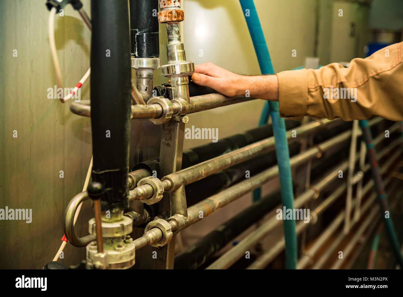 Hand touching pipe hi-res stock photography and images - Alamy