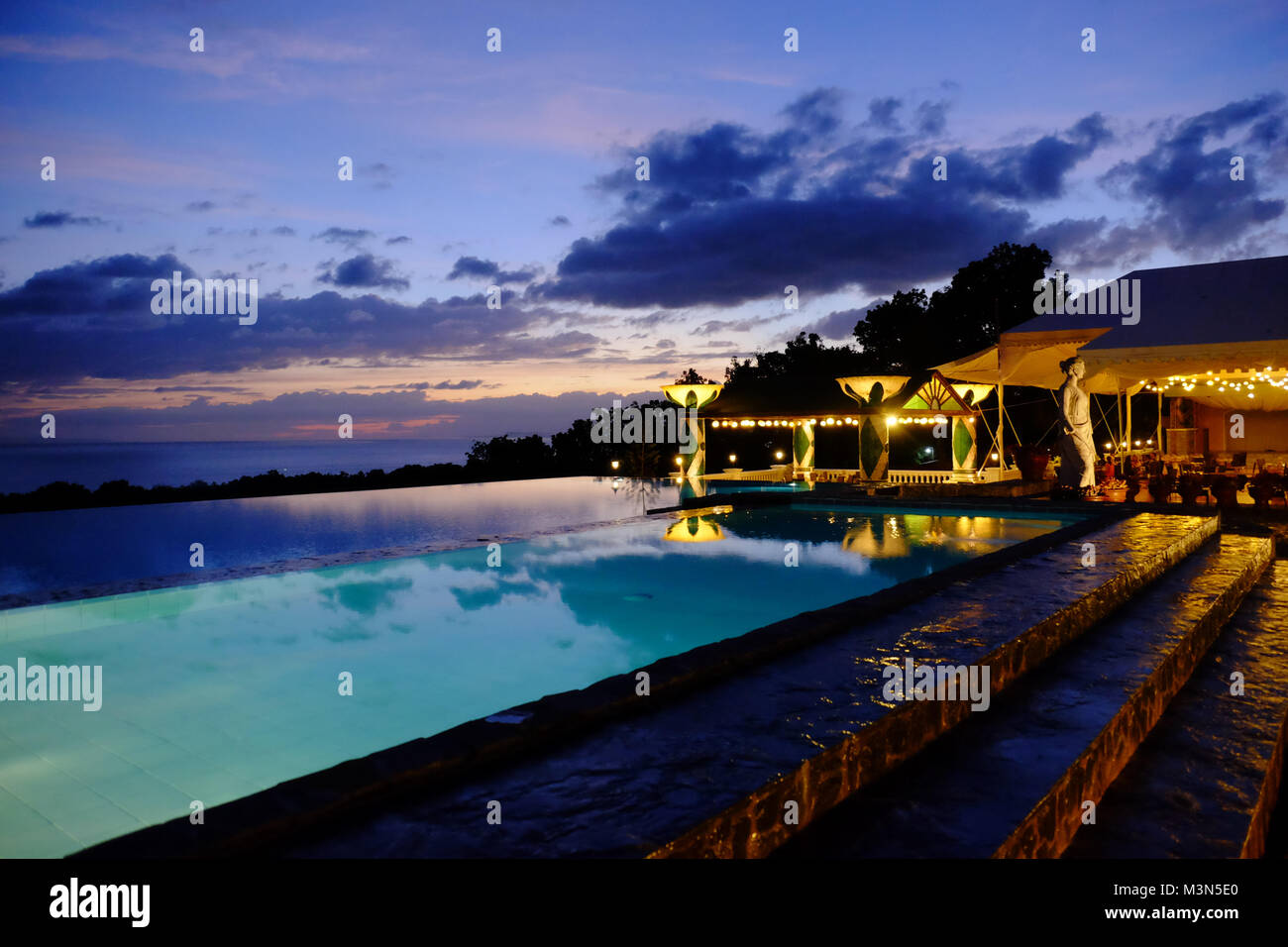 An illuminated infinity pool in the Philippines at night Stock Photo ...