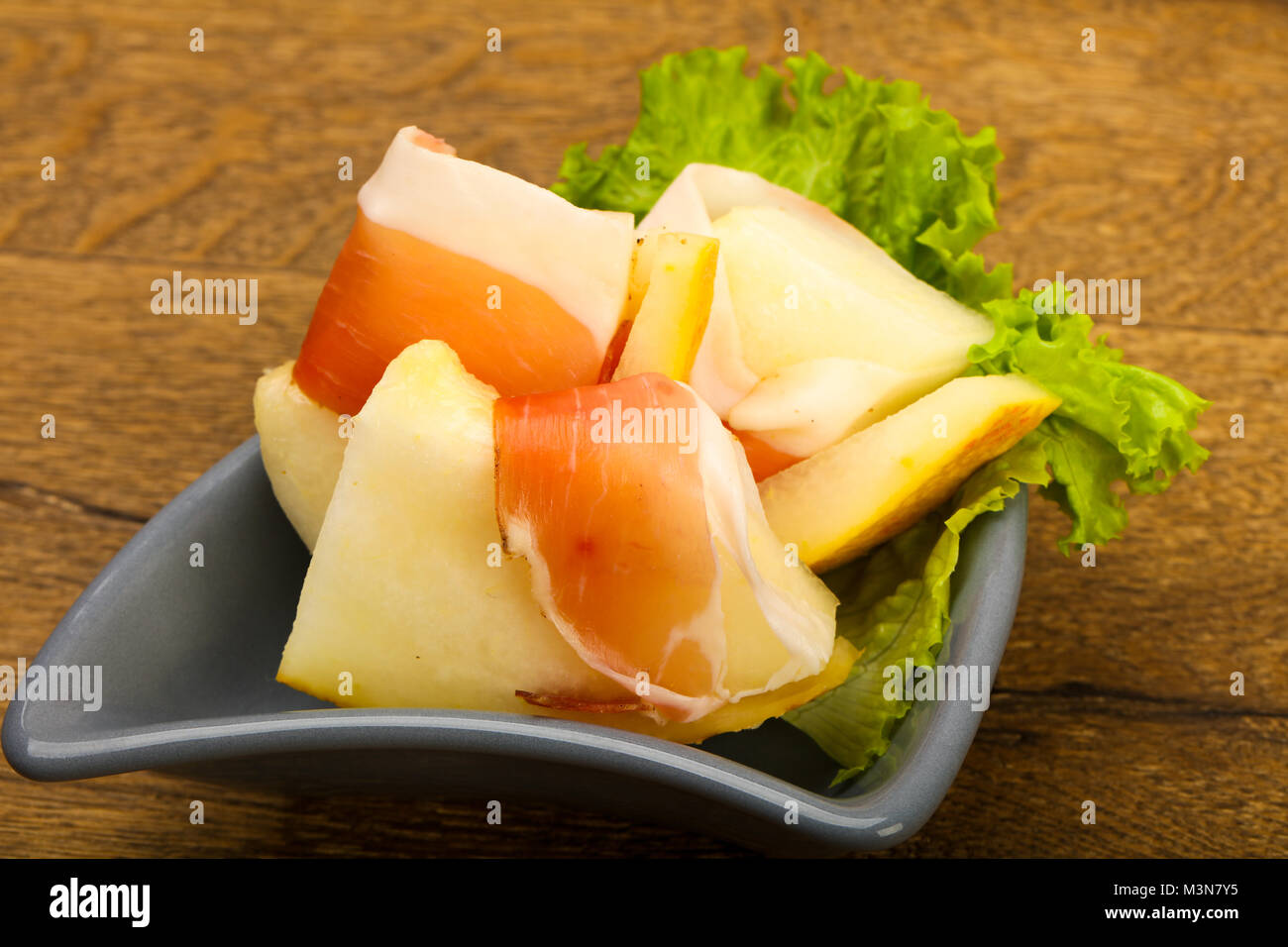 Spanish Hamon with melon Stock Photo - Alamy
