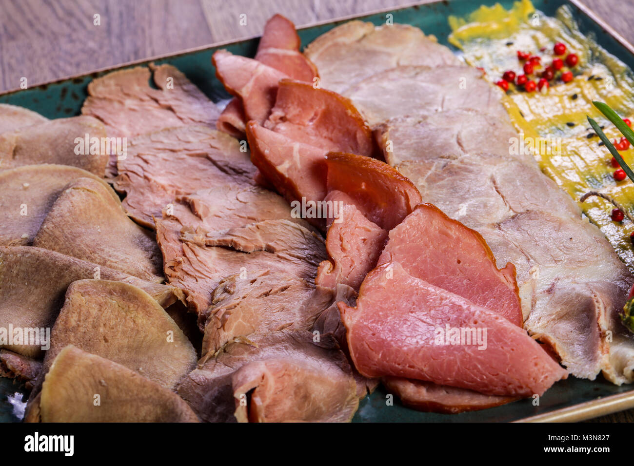 Pork meat plate snack assortment Stock Photo - Alamy