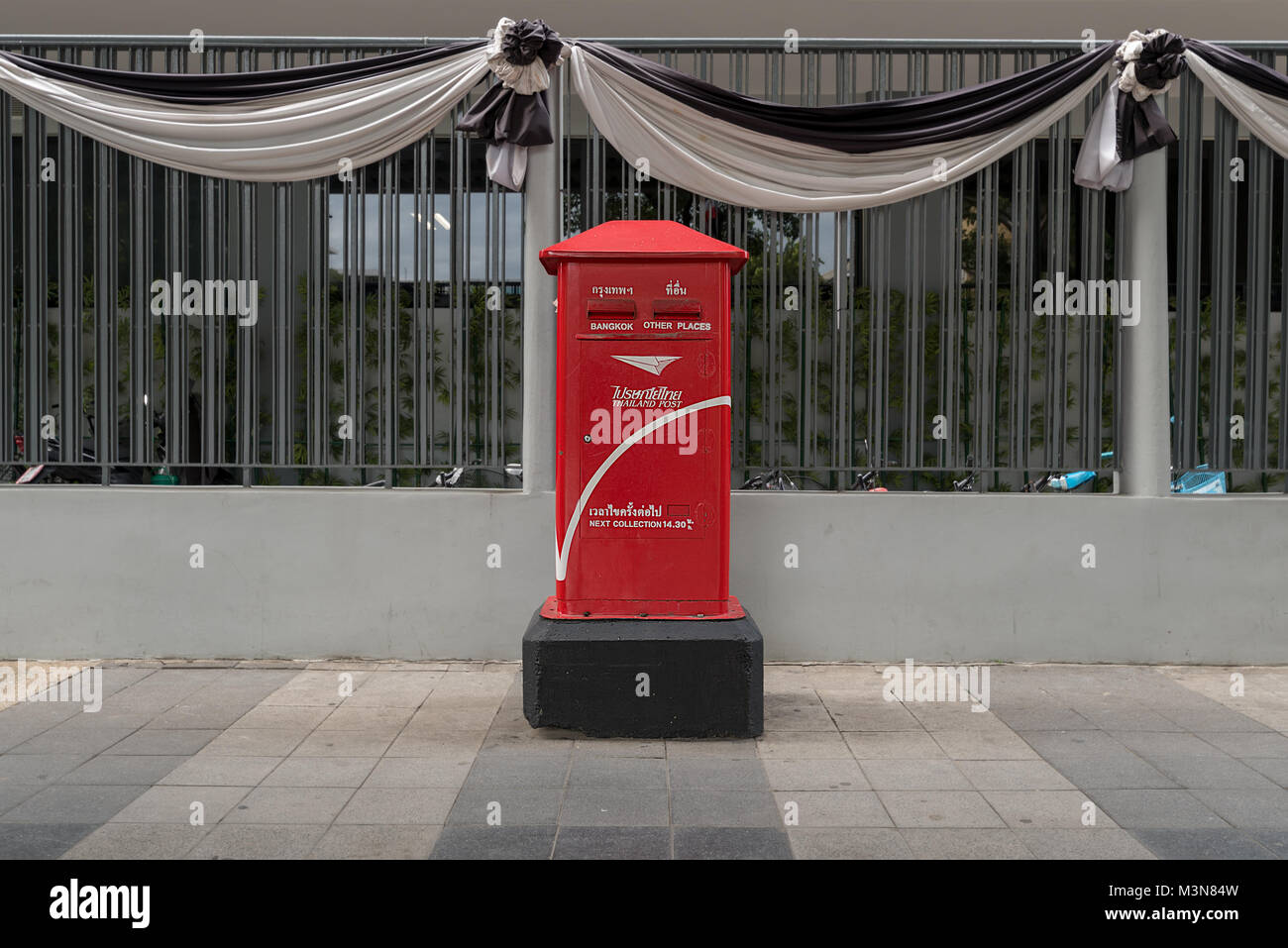 City street view of a Bangkok located Thailand Post red post box with ...