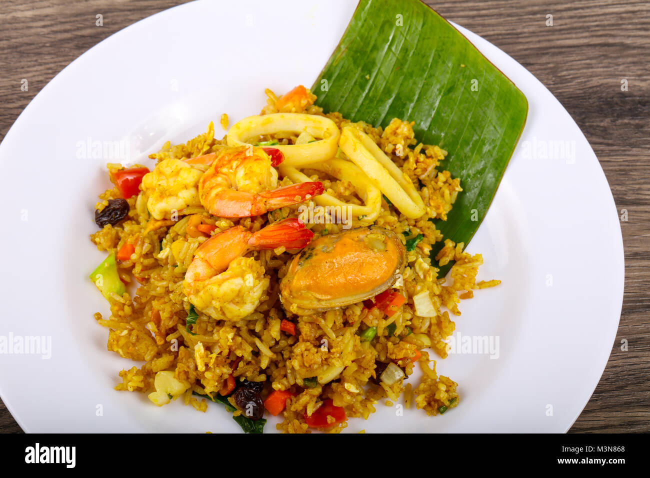 Fried rice with seafood - shrimp, mussel, squid Stock Photo - Alamy