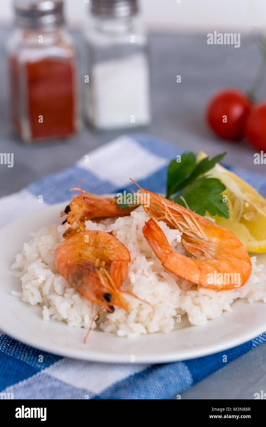 Plate with fried prawns and rice. Seafood Stock Photo - Alamy