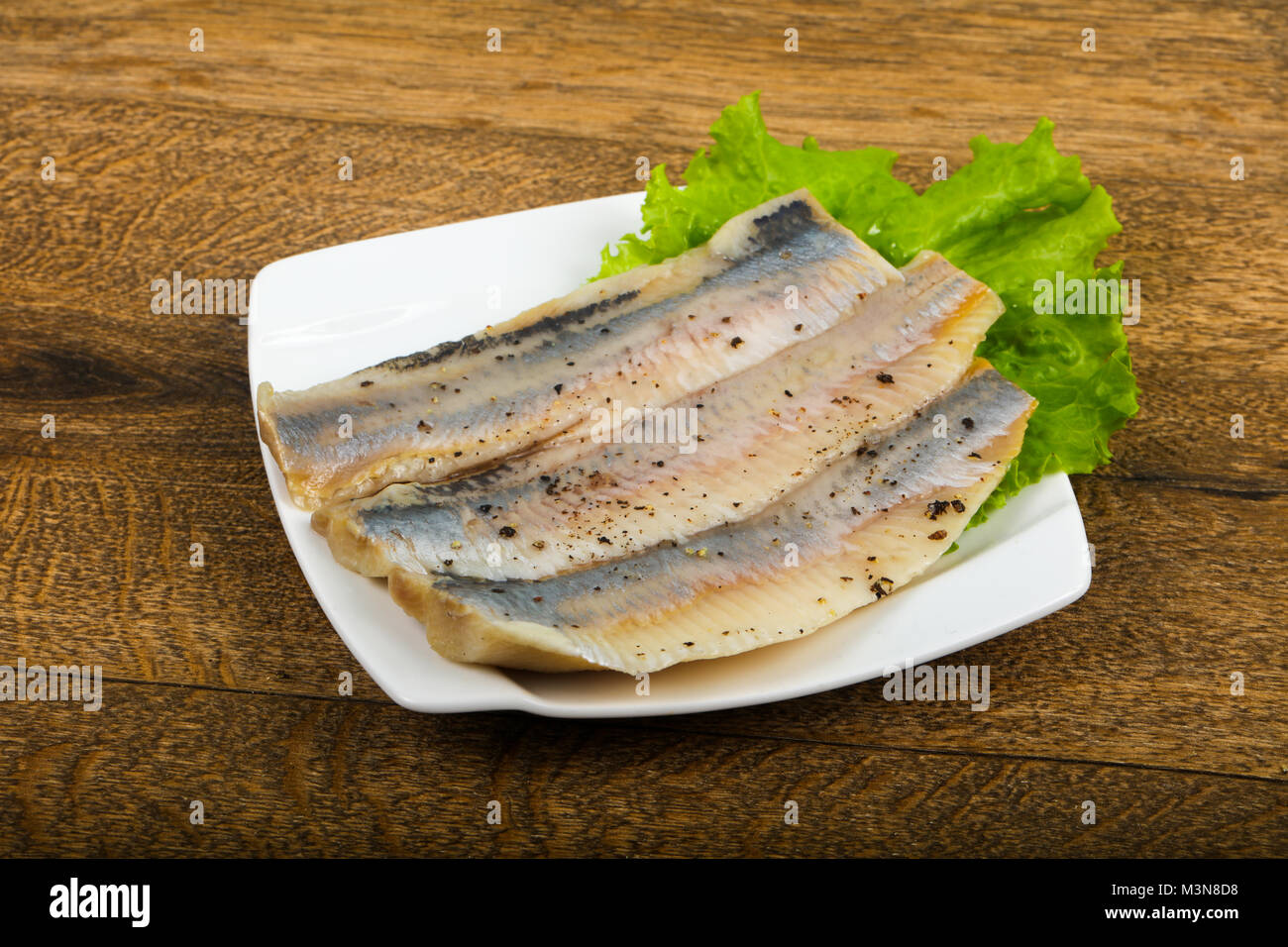 Herring fillet with pepper Stock Photo - Alamy
