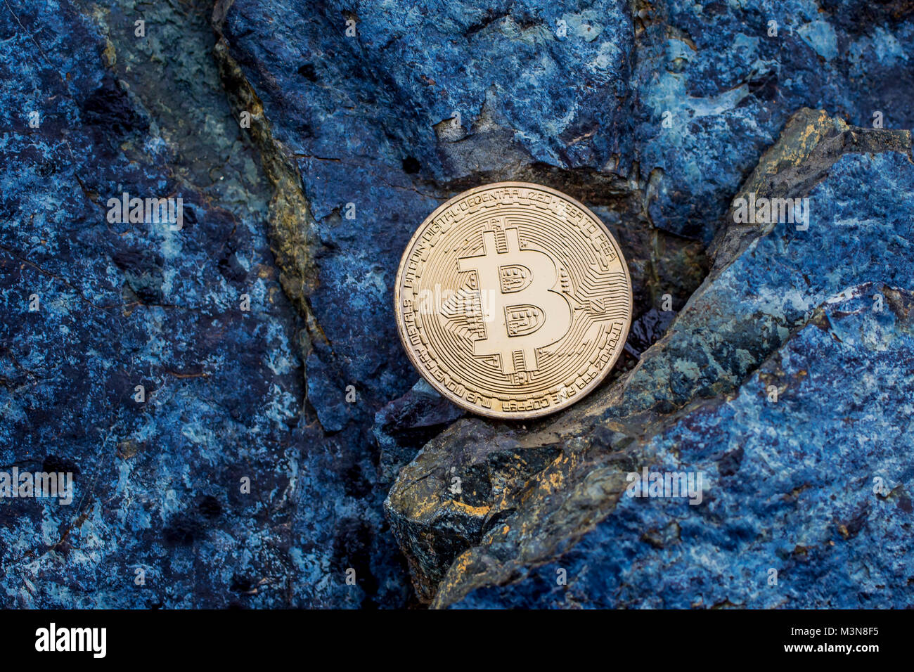 bitcoin on the stone background Stock Photo - Alamy