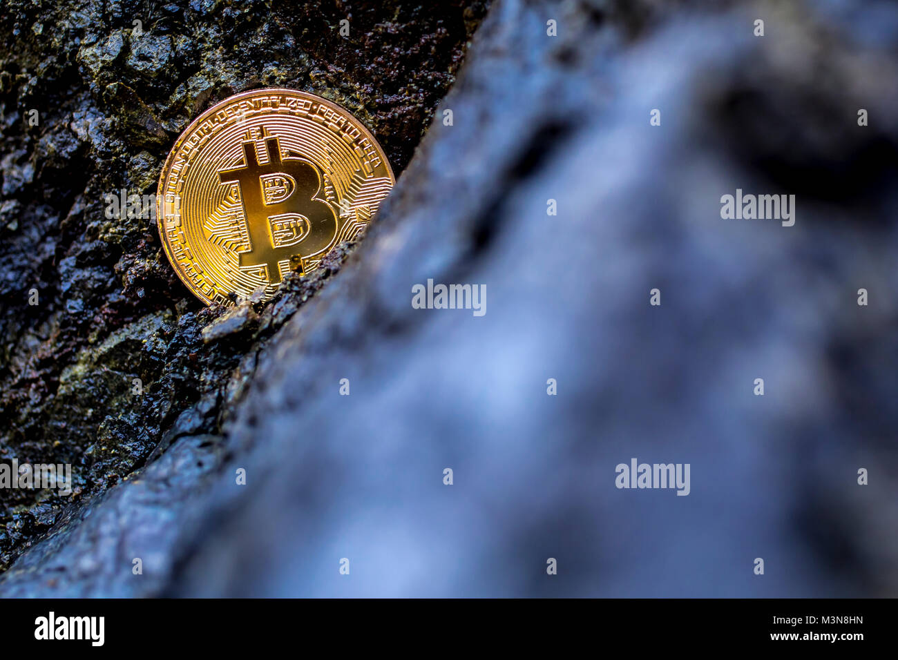 bitcoin on the stone background Stock Photo - Alamy