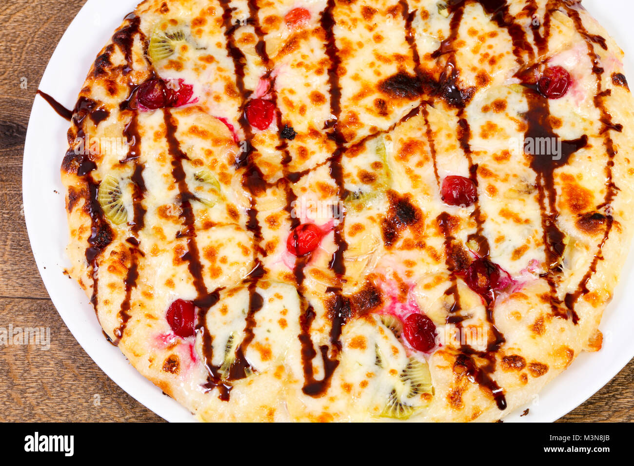 Sweet pizza with fruits and mozzarella Stock Photo - Alamy