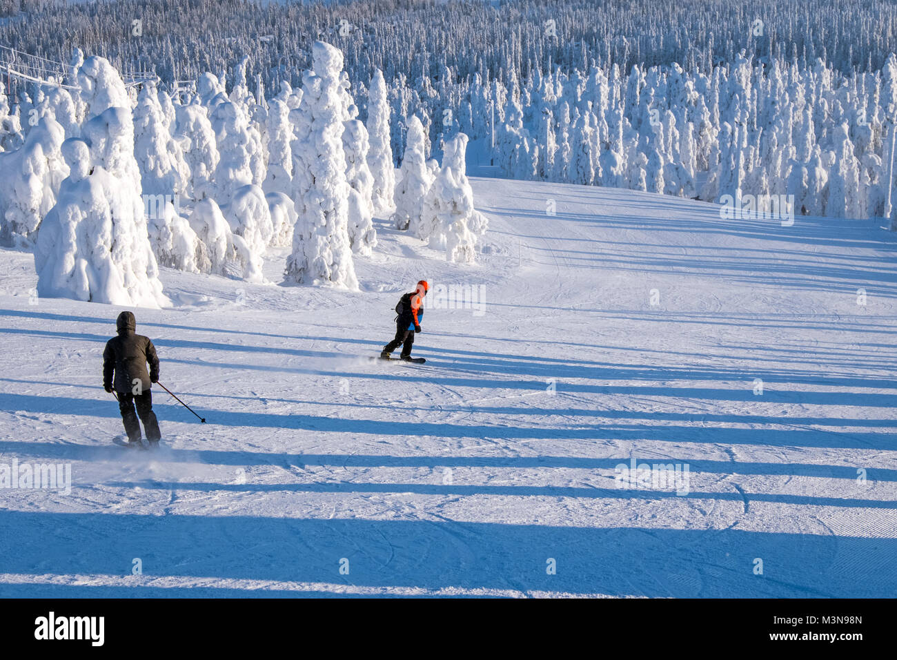 Skiers on piste atThe ski resort of Ruka in Finland Stock Photo - Alamy