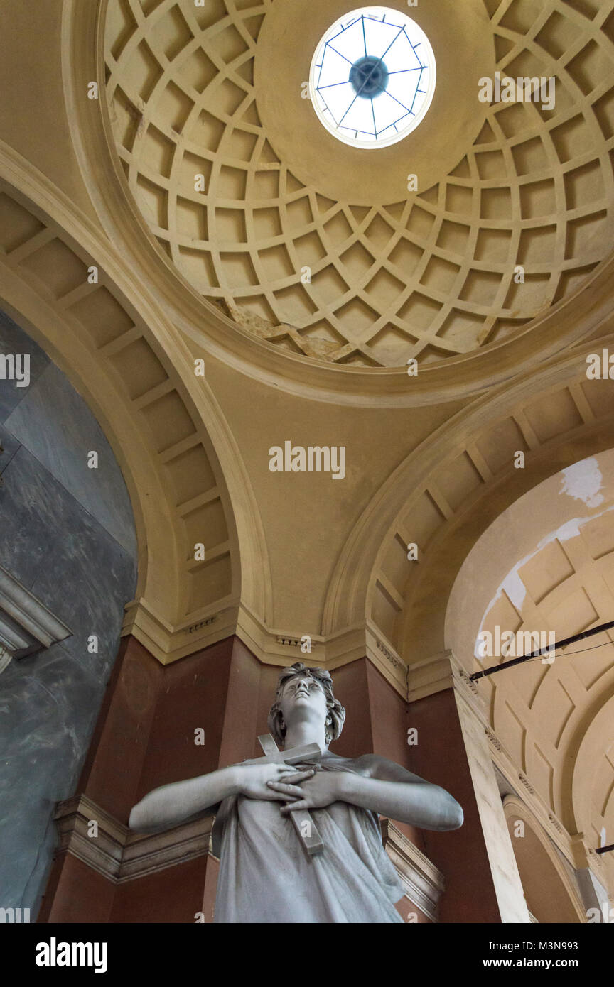 Statue of a religious sad woman praying isolated on church background ...