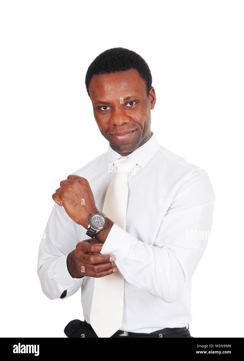 A good looking African American man standing in a portrait image in a ...