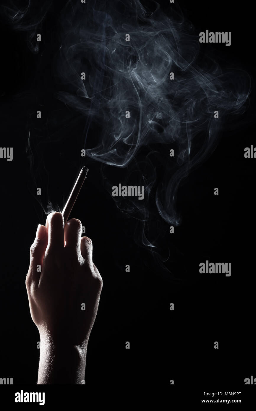 Female hand holding cigarette hi-res stock photography and images - Alamy