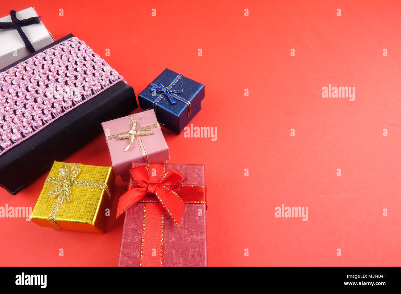 GIFT BOXES ON RED BACKGROUND Stock Photo - Alamy