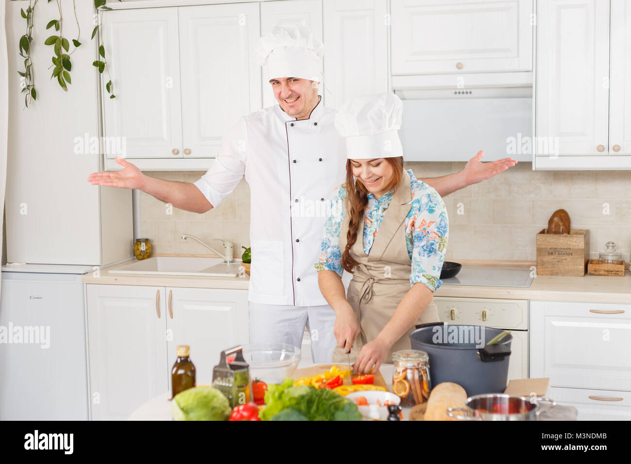 A senior chef giving cooking lesson to young chefs Stock Photo - Alamy