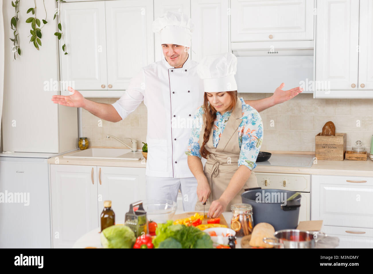 A senior chef giving cooking lesson to young chefs Stock Photo - Alamy