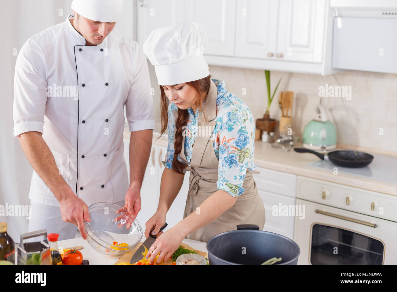 Two chefs are working together Stock Photo - Alamy