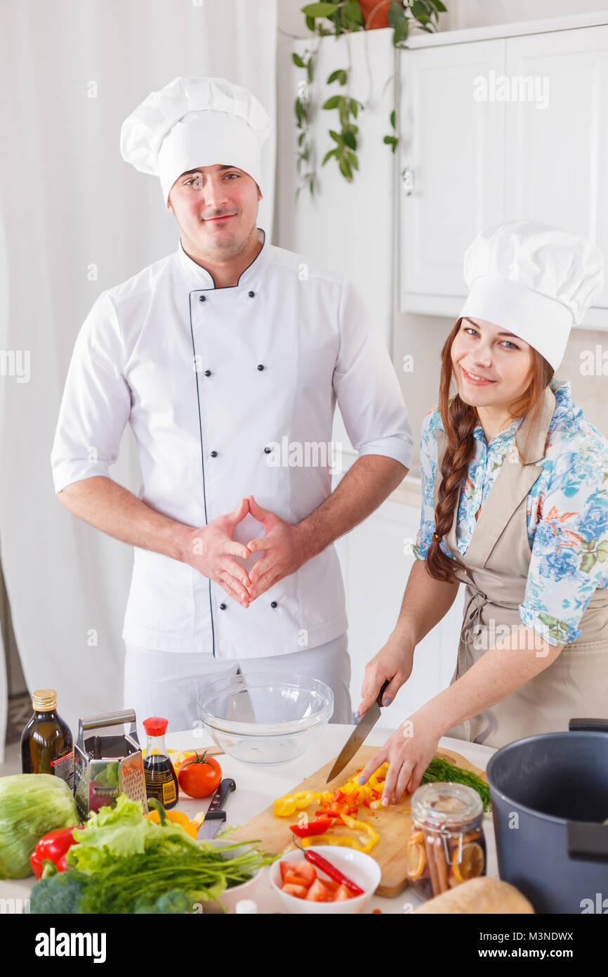 Two chefs are working together. Vertical photo Stock Photo - Alamy