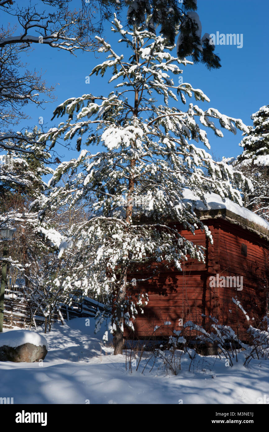 Red storehouse at Skansen on a snowy winter morning Stock Photo - Alamy