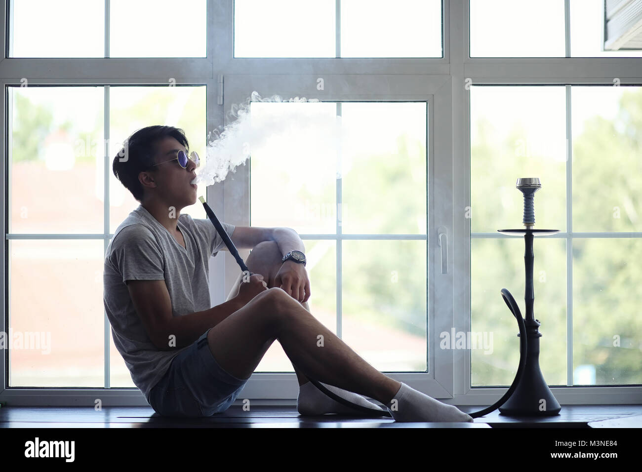 Man Smoking Shisha Young High Resolution Stock Photography and Images ...
