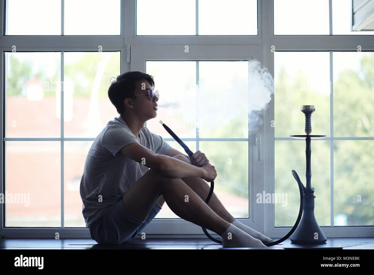 Man smoking shisha young hi-res stock photography and images - Alamy