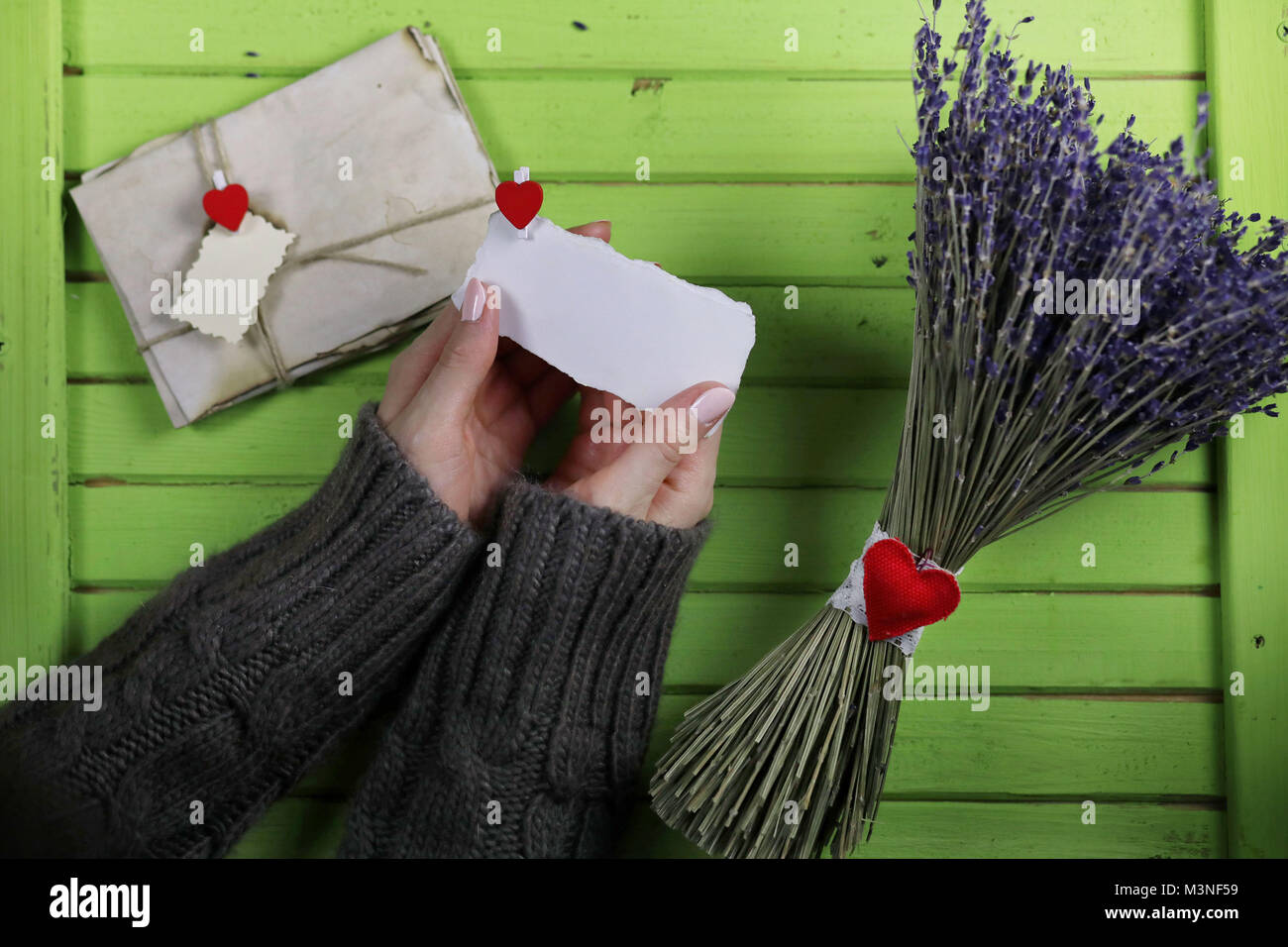 Girl drinking hot coffee and looks presented valentines Stock Photo - Alamy