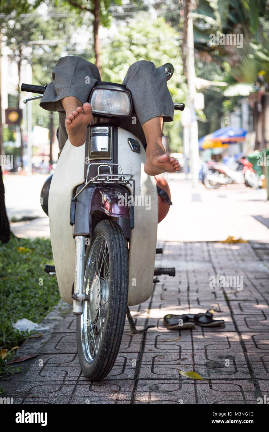 man sleeping on bike Stock Photo - Alamy