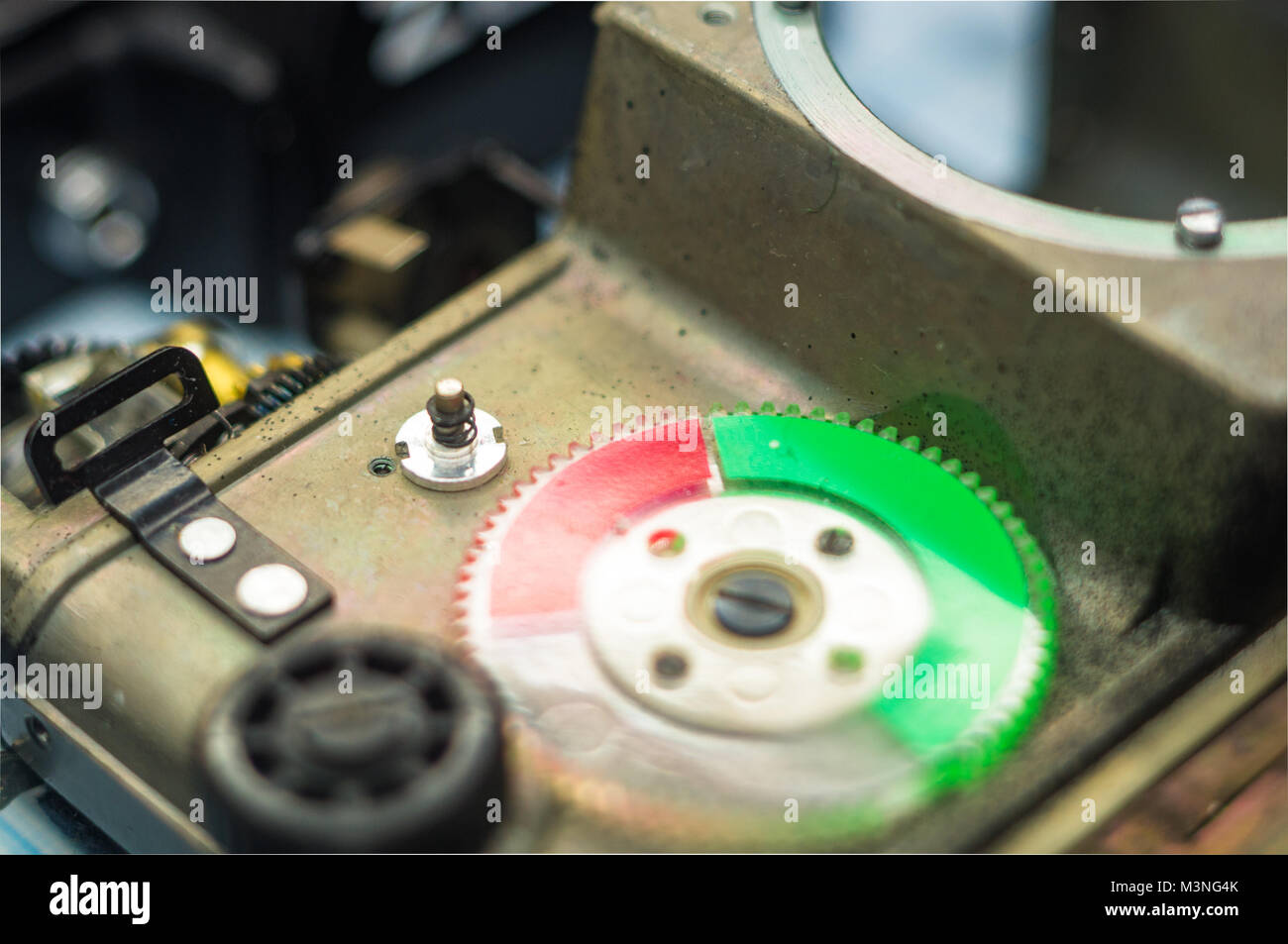 parts are completely disassembled old retro film SLR camera on graph ...