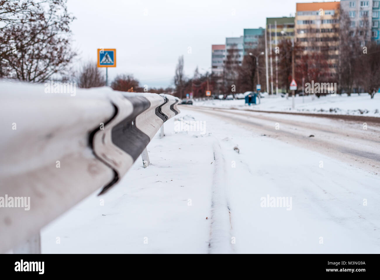Snow covered road with pedestrian crossing hi-res stock photography and ...