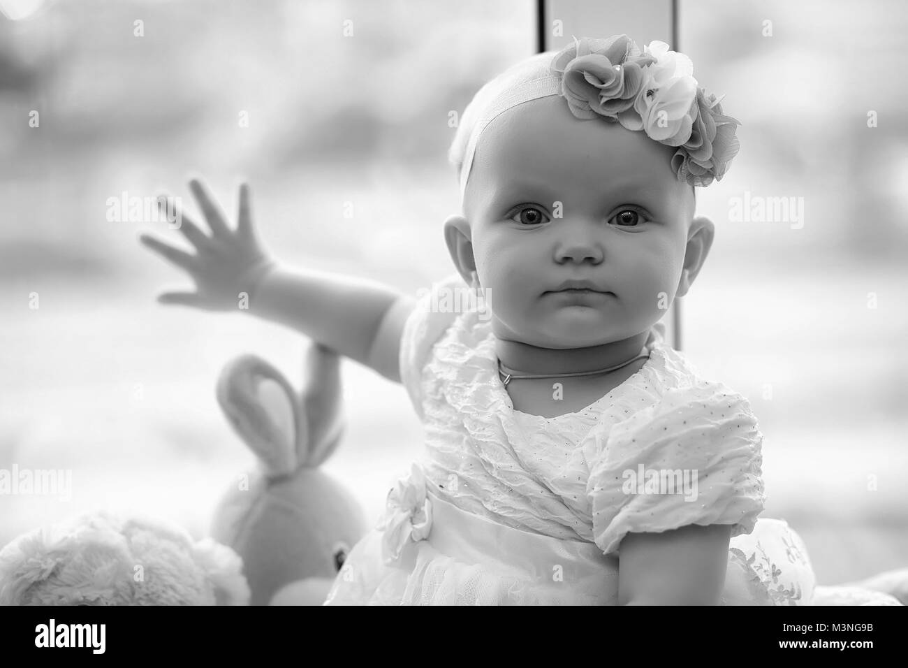 Child in the children's room. The kid is sitting on the windowsi Stock ...