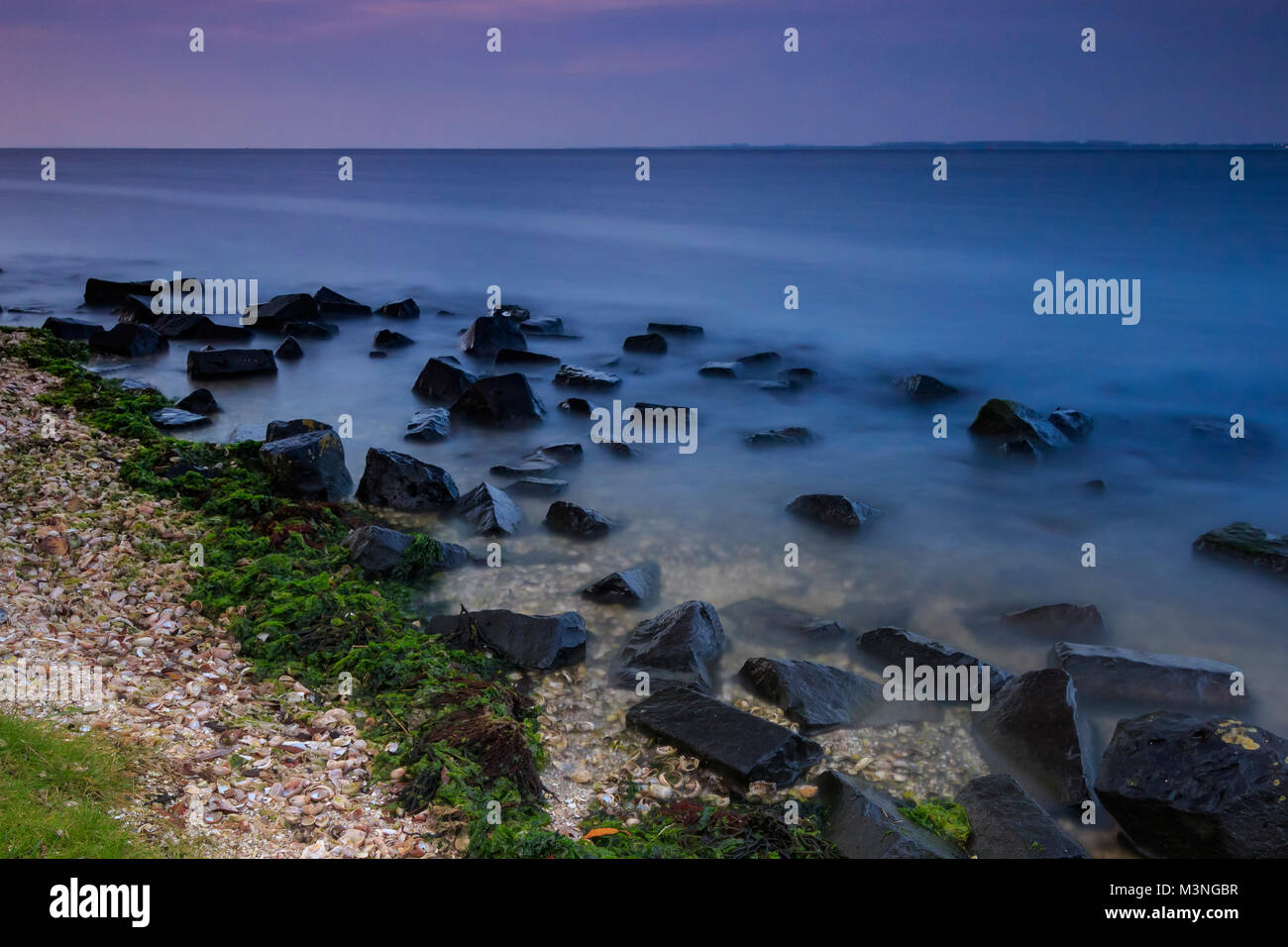 Rocks on the zeeland coast of the netherlands hi-res stock photography ...