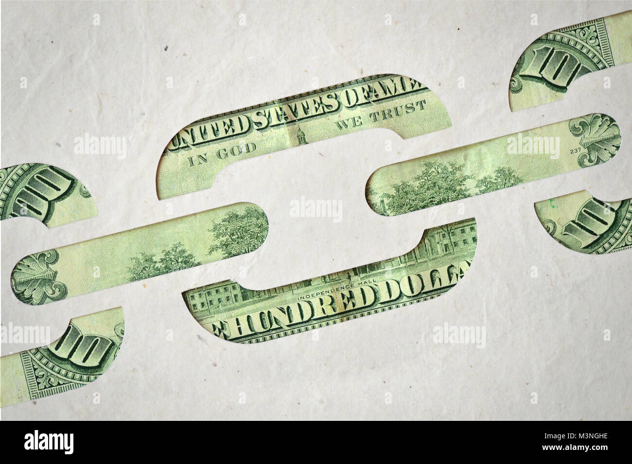 Paper chain cut-out on dollar background Stock Photo - Alamy