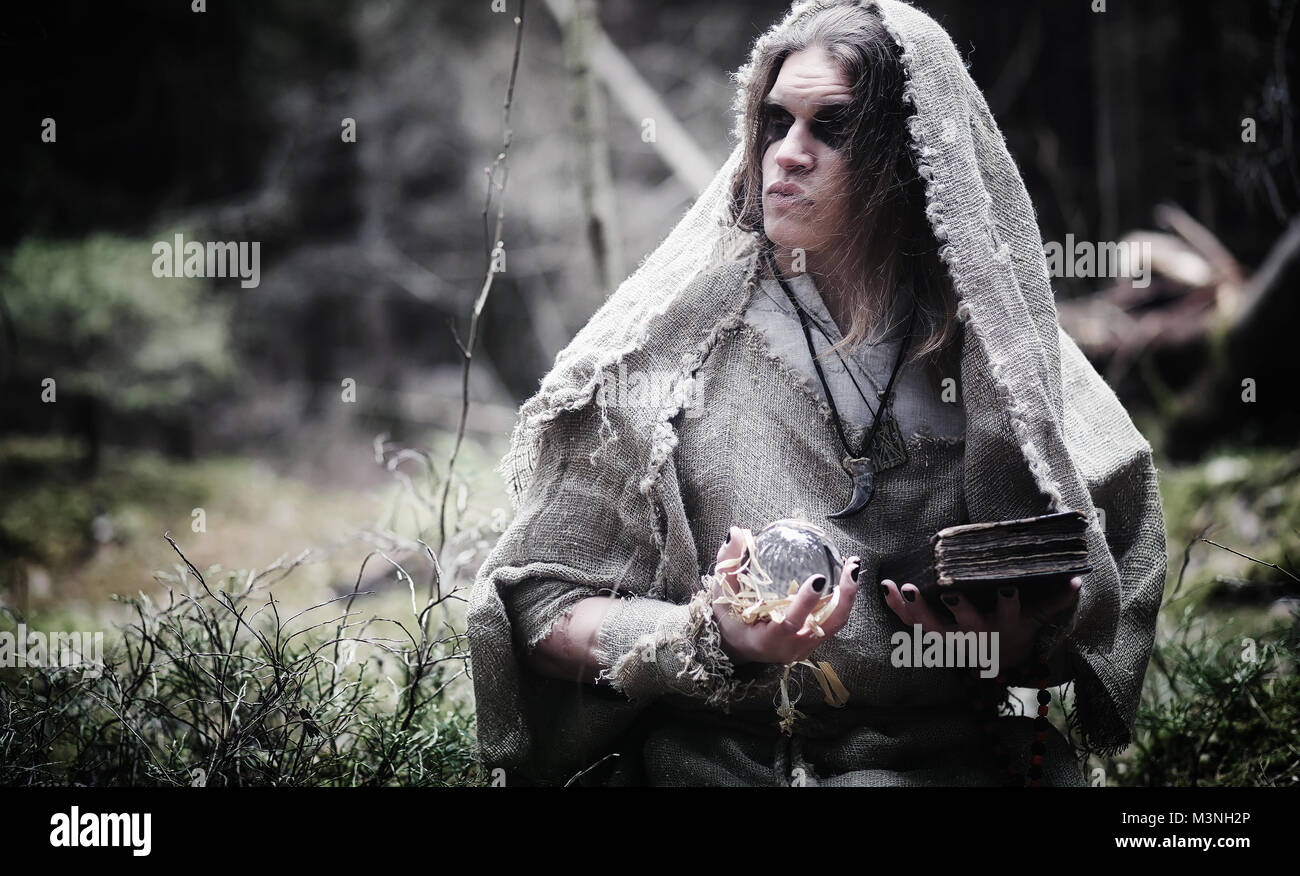 Fairy magician. A sorcerer with a glass sphere, a magical spell Stock ...