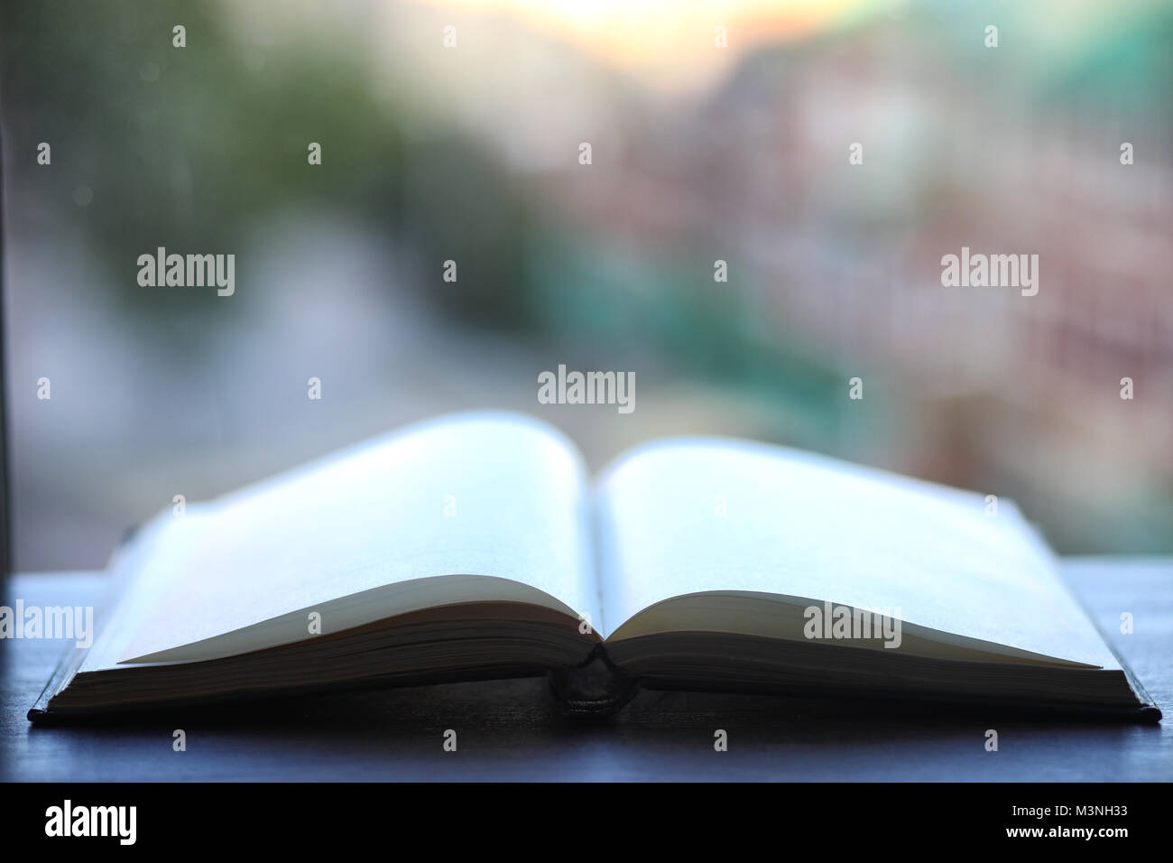 open book and a table Stock Photo - Alamy