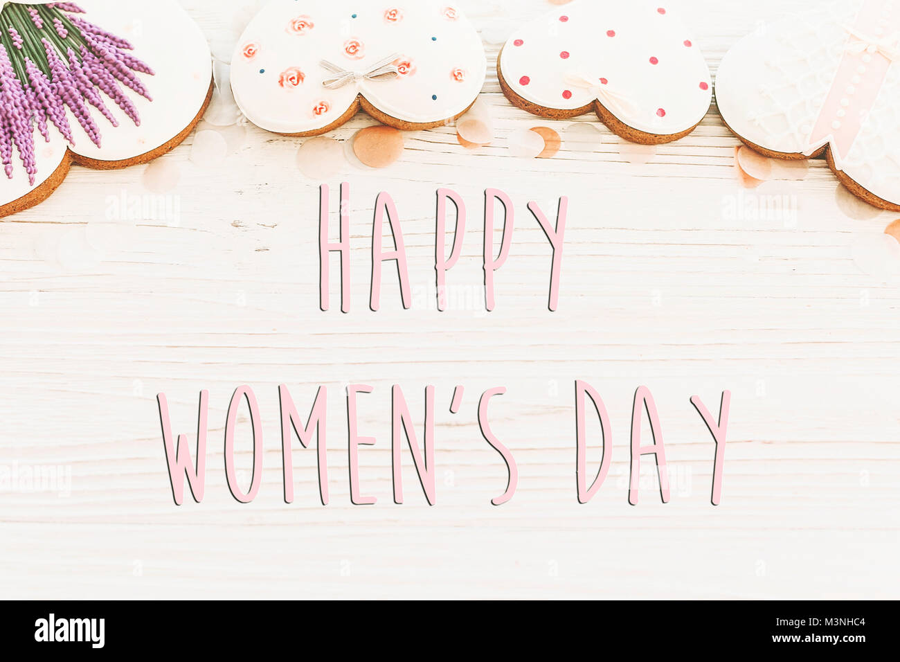 happy women's day text sign flat lay. 8 march. pink hearts flowers and ...