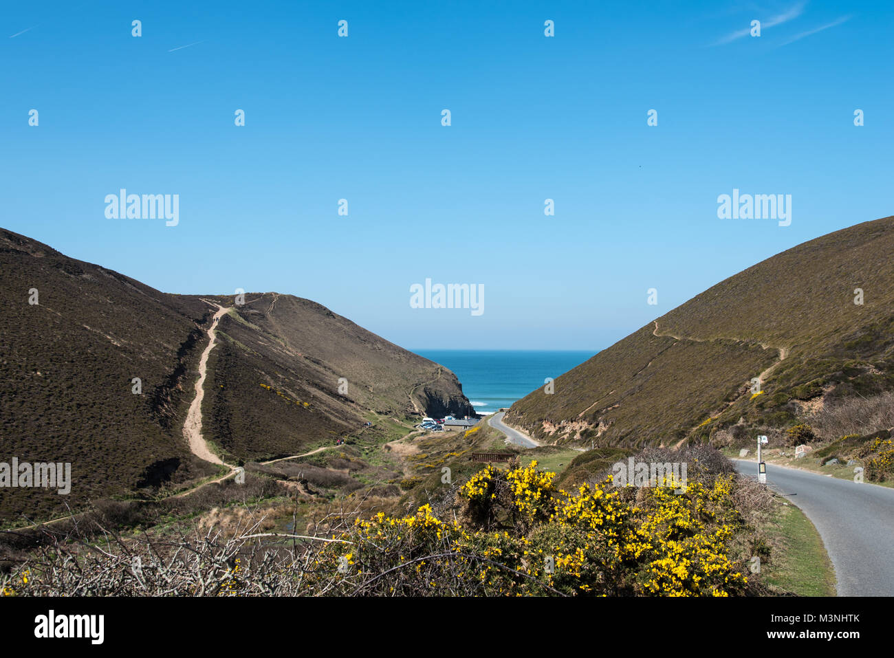 Cornwall, UK. Coastal road leading down to sea on Cornish coastline ...