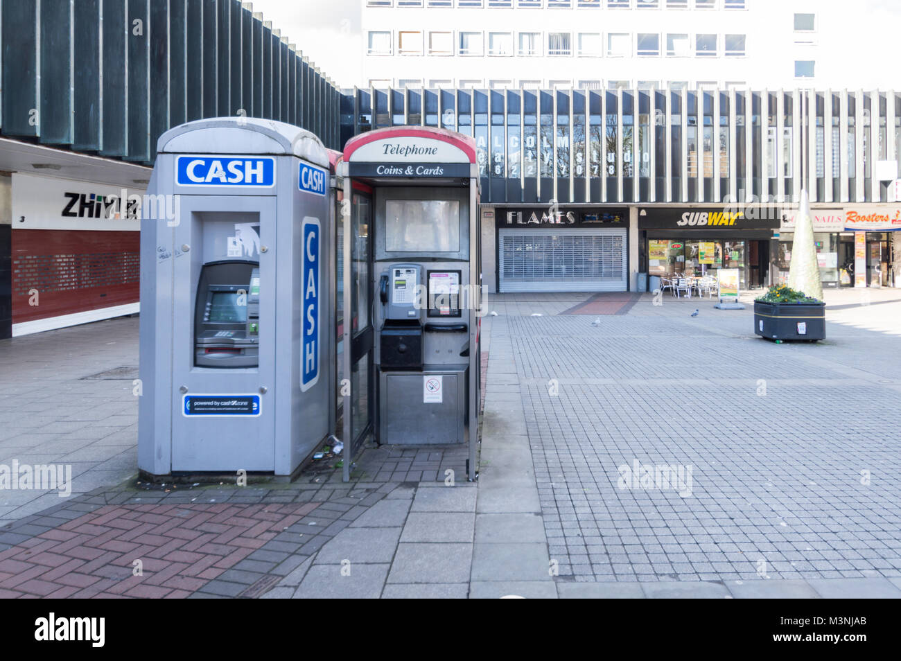 Old style push button telephone box and cash machine in the Bull Yard ...