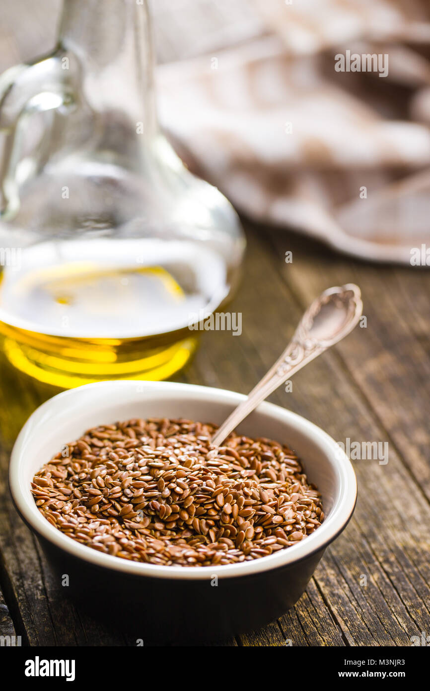 Healthy brown linseed in bowl Stock Photo - Alamy
