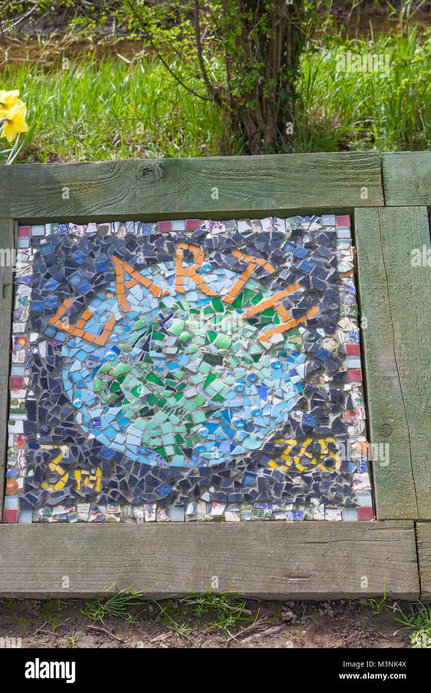 A woman views the Mosaic art work of the Solar System designed by ...